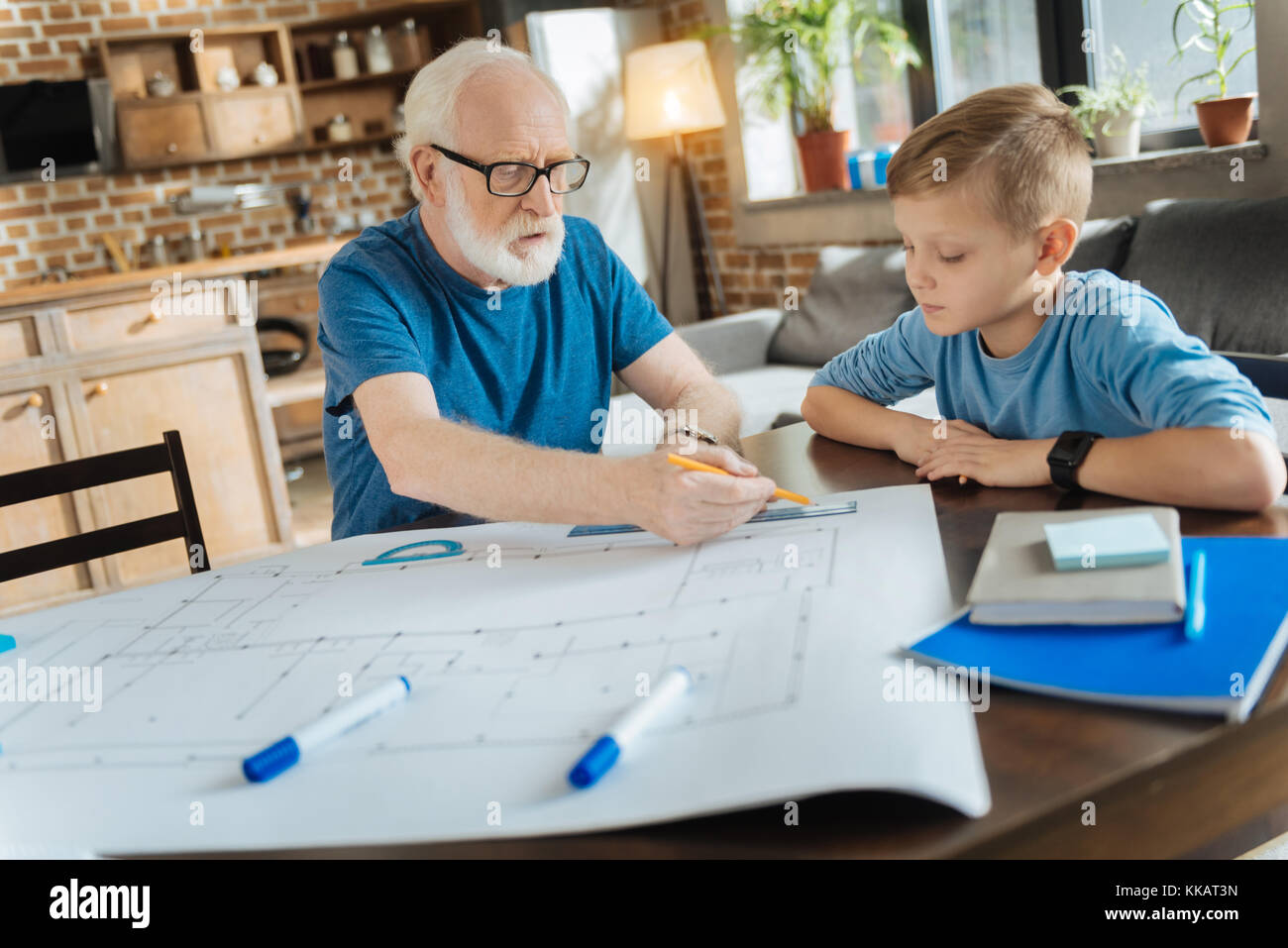 Serious boy doing home hi-res stock photography and images - Alamy