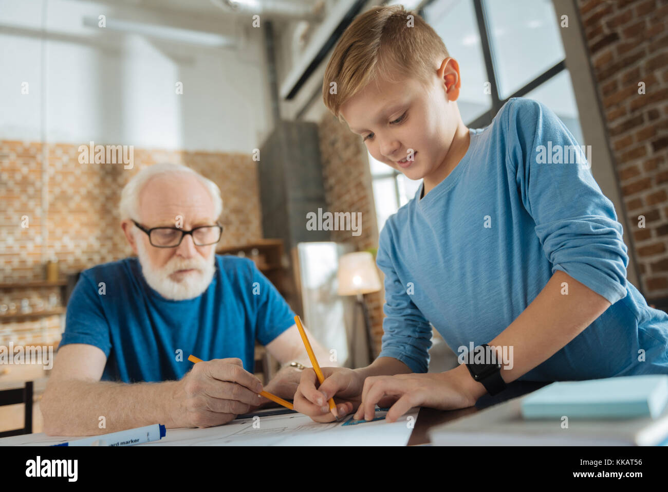 Cute enthusiastic boy holding a pencil Stock Photo - Alamy