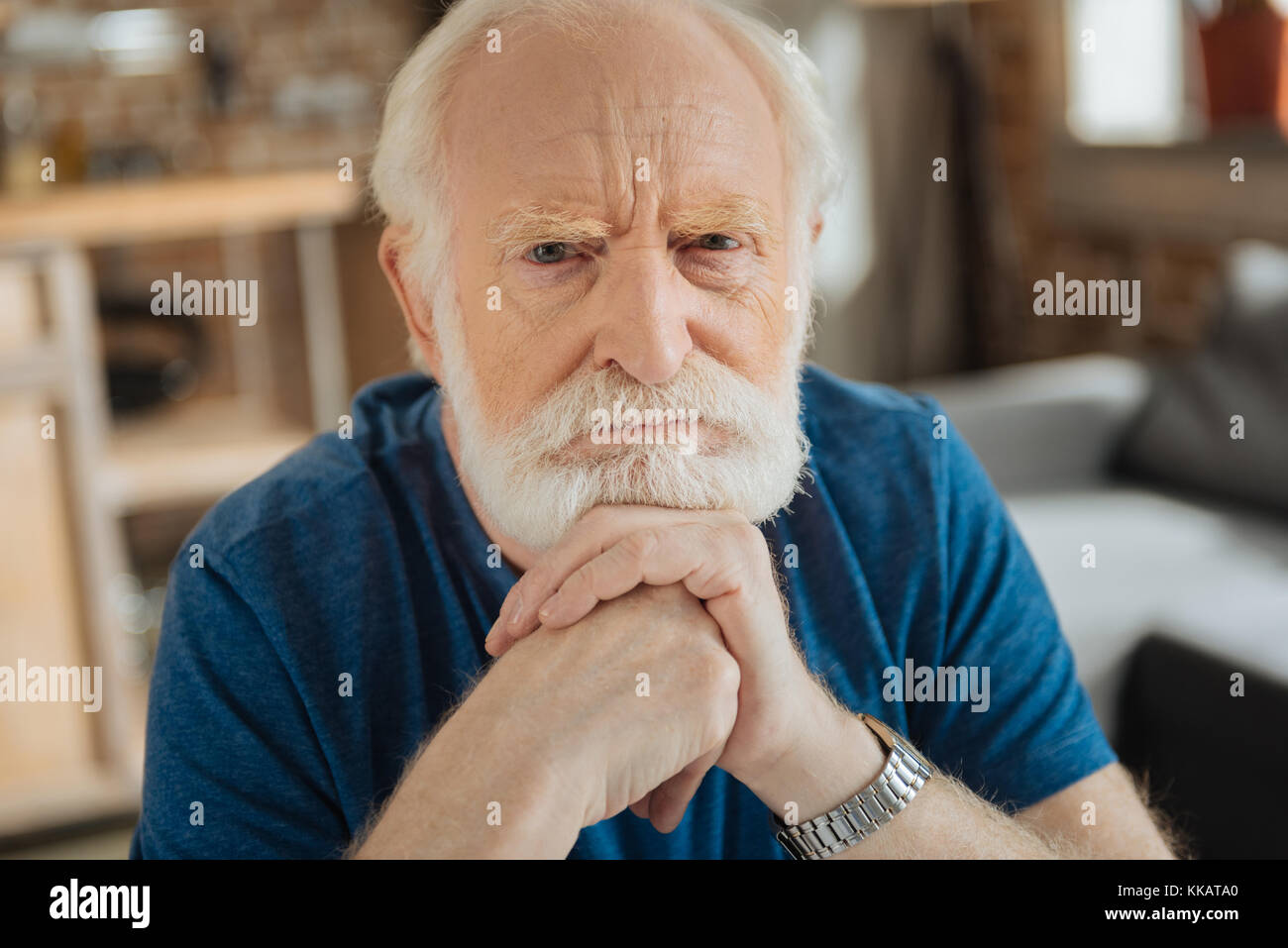 Smart wise man holding his chin Stock Photo - Alamy