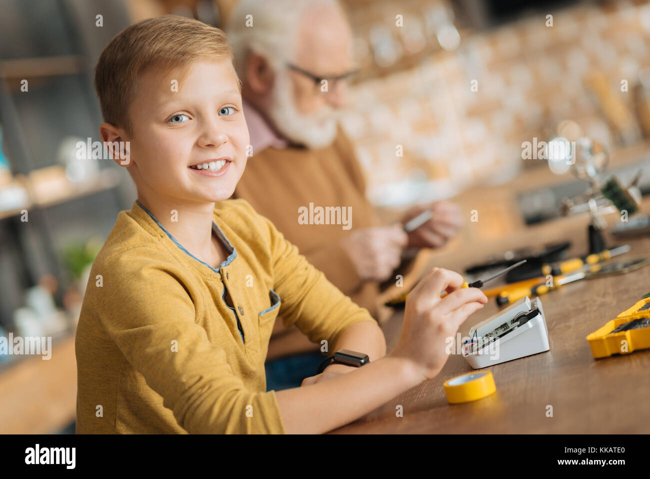 Happy positive boy smiling to you Stock Photo - Alamy