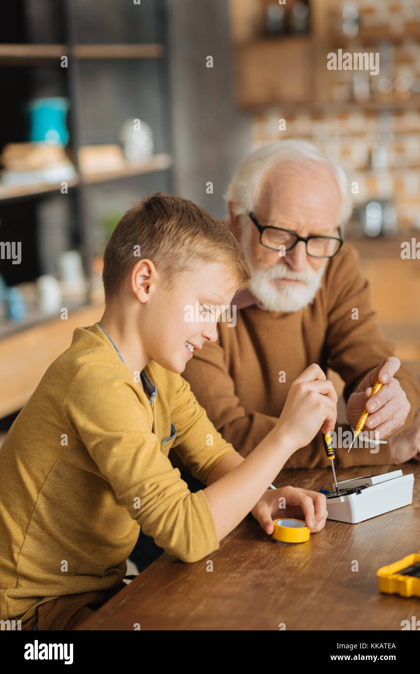 Boy fixing hi-res stock photography and images - Alamy