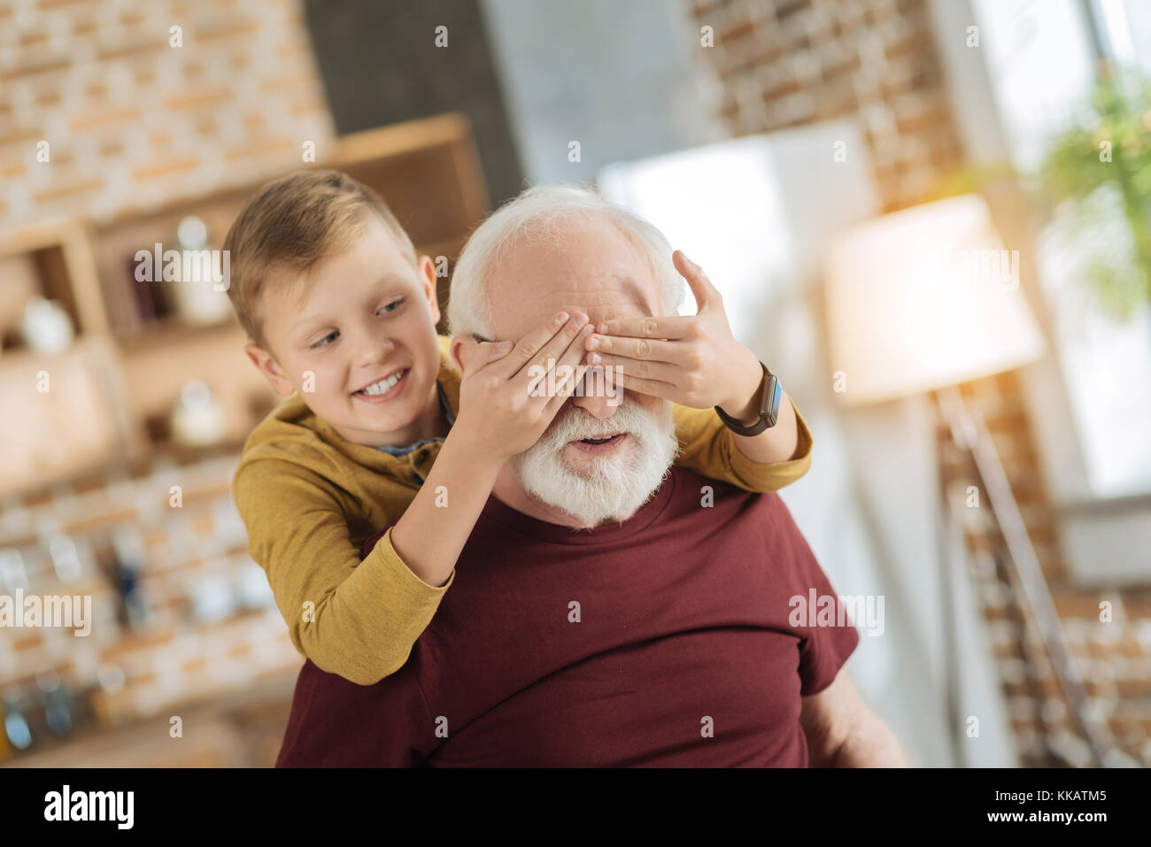 Nice excited boy preparing a surprise Stock Photo - Alamy