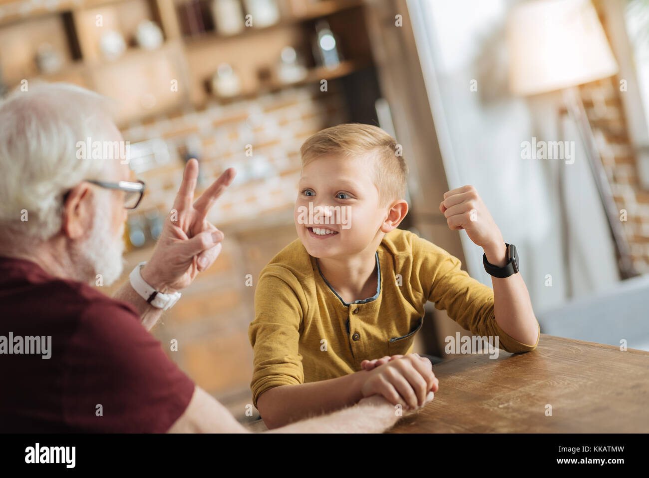 Positive happy grandfather and grandson having fun Stock Photo - Alamy