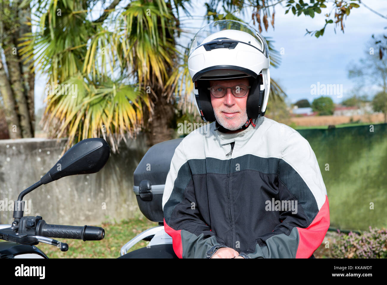 a portrait of a senior biker on his motorcycle Stock Photo - Alamy