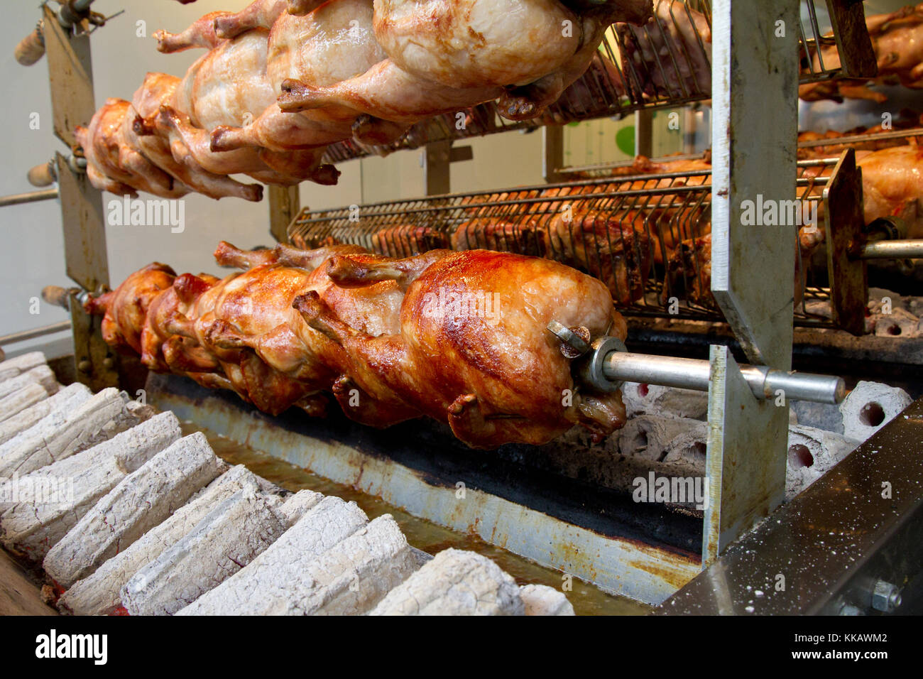 Chicken being cooked over coal Stock Photo - Alamy