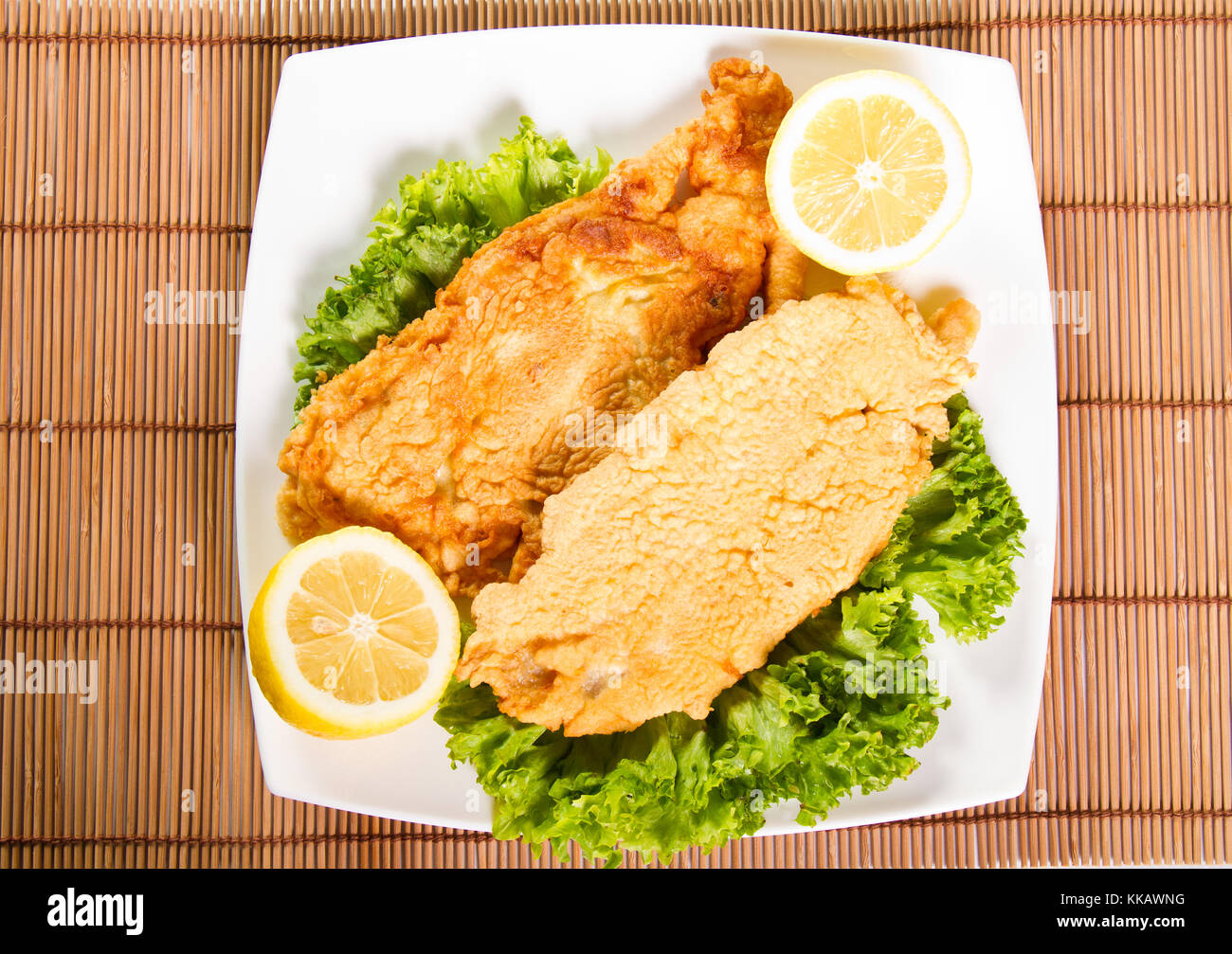 Fried fish fillet with lemon Stock Photo - Alamy