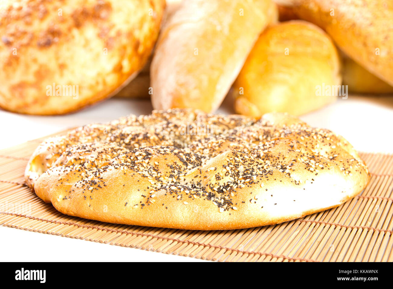 Loaf of bread on a wooden mat Stock Photo - Alamy