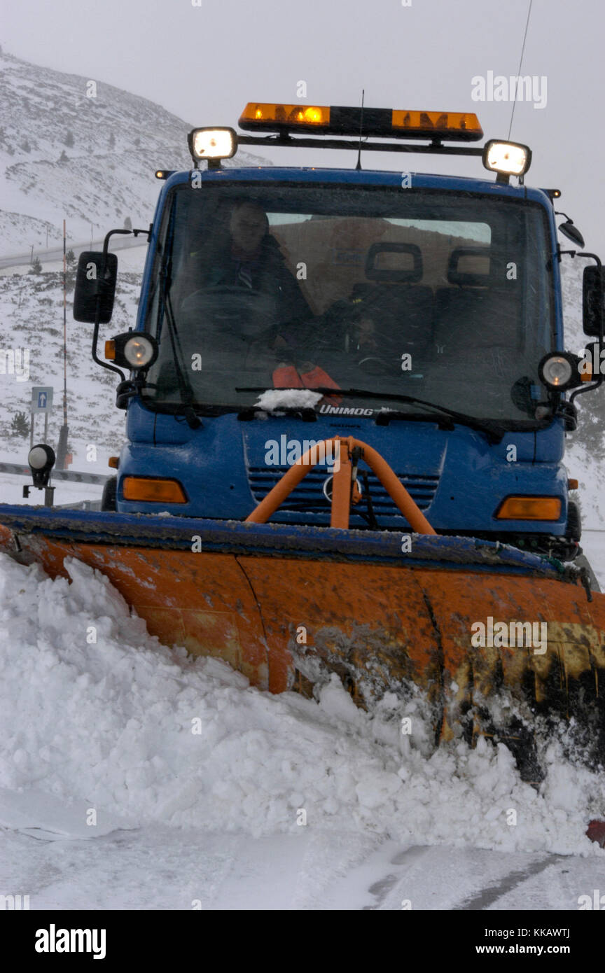 A snow plough clearing a road of snow after a heavy snow fall near the ...