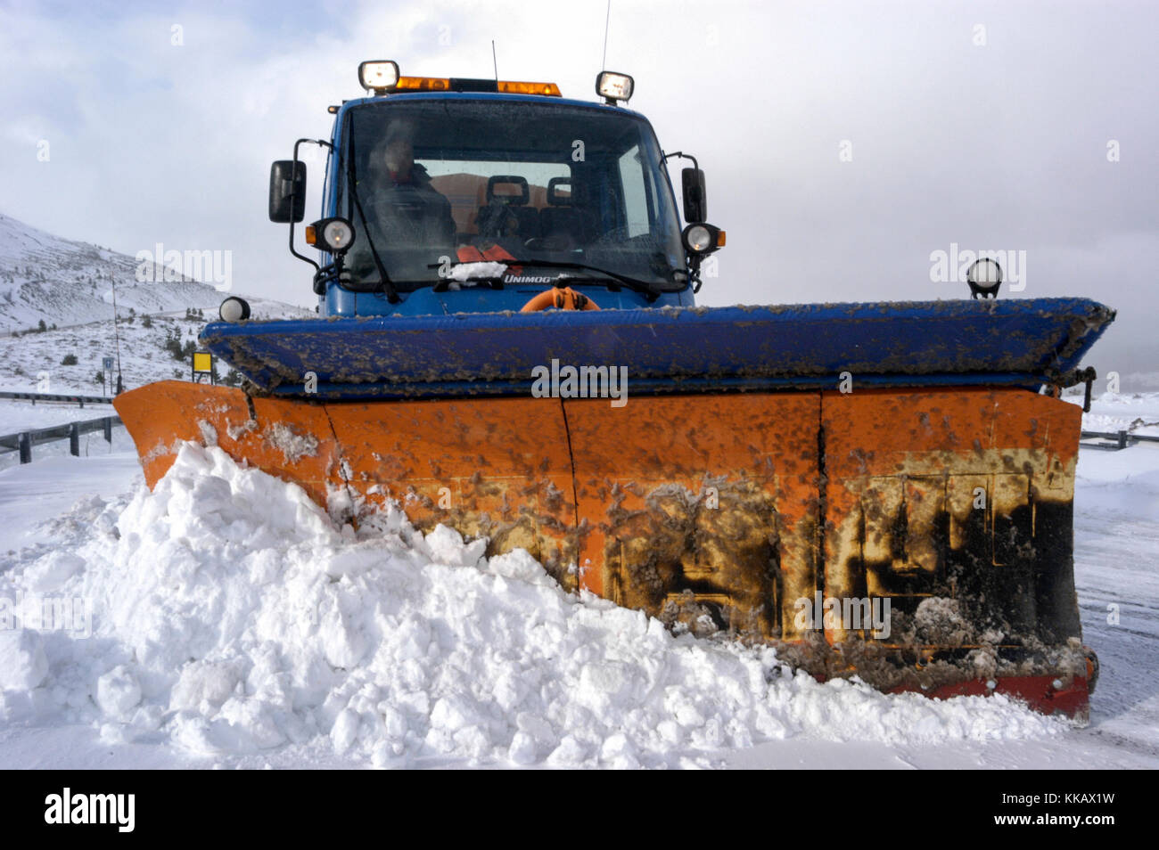 A snow plough clearing a road of snow after a heavy snow fall near the ...