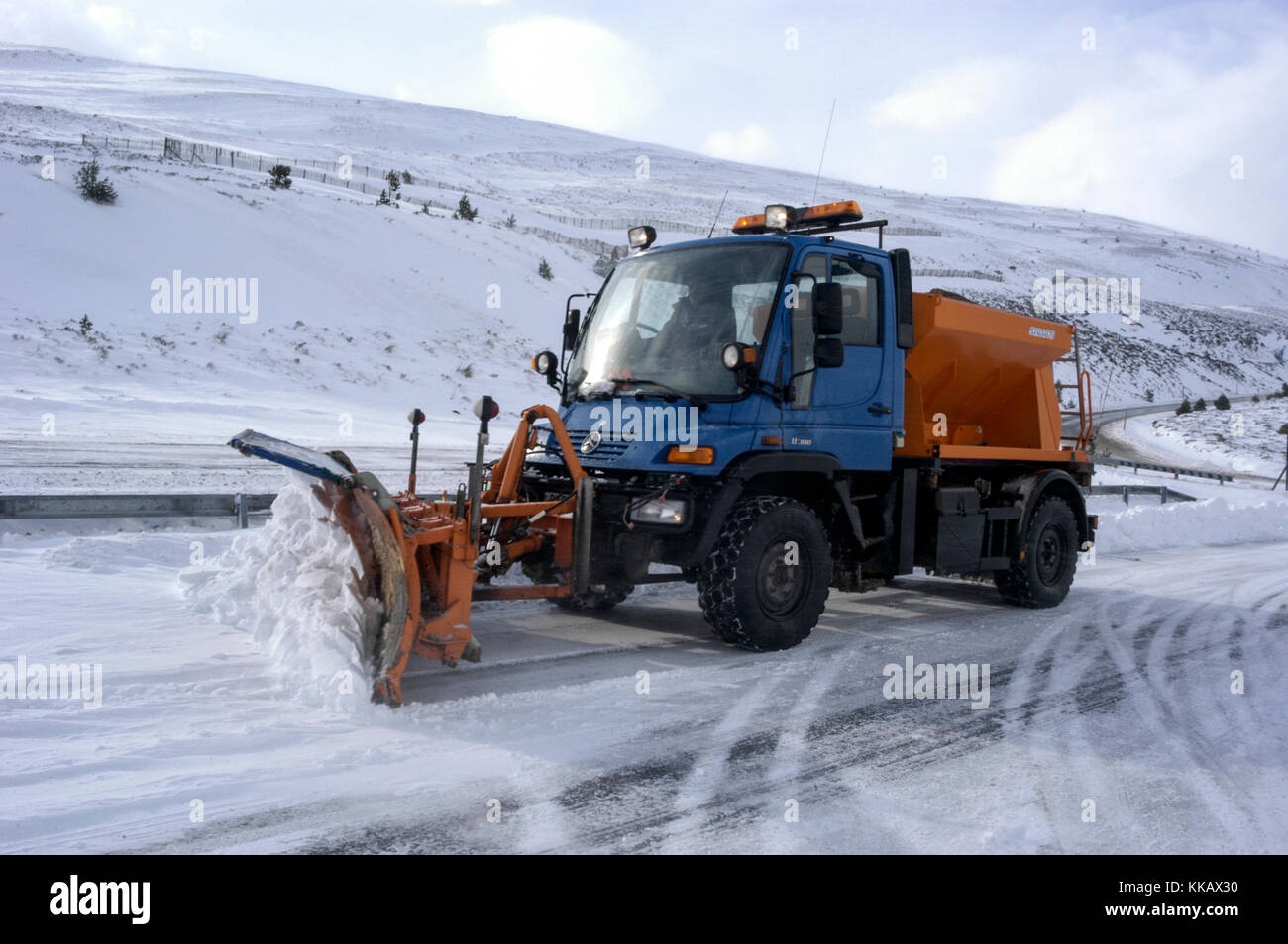 A snow plough clearing a road of snow after a heavy snow fall near the ...