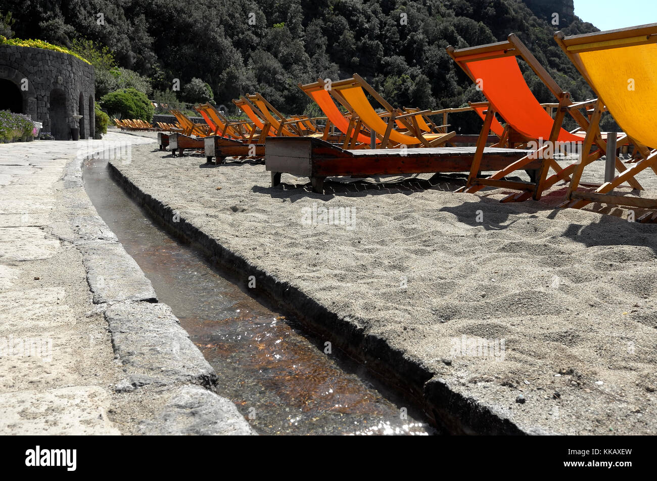 Deck chairs on the sandy terrace by the sea at a thermal bathing ...