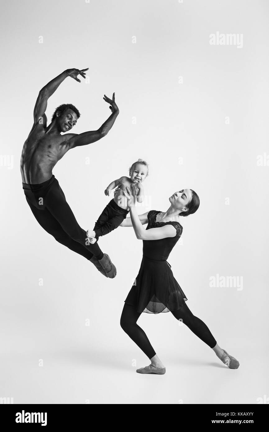 A happy family of ballet dancers on white studio background Stock Photo ...