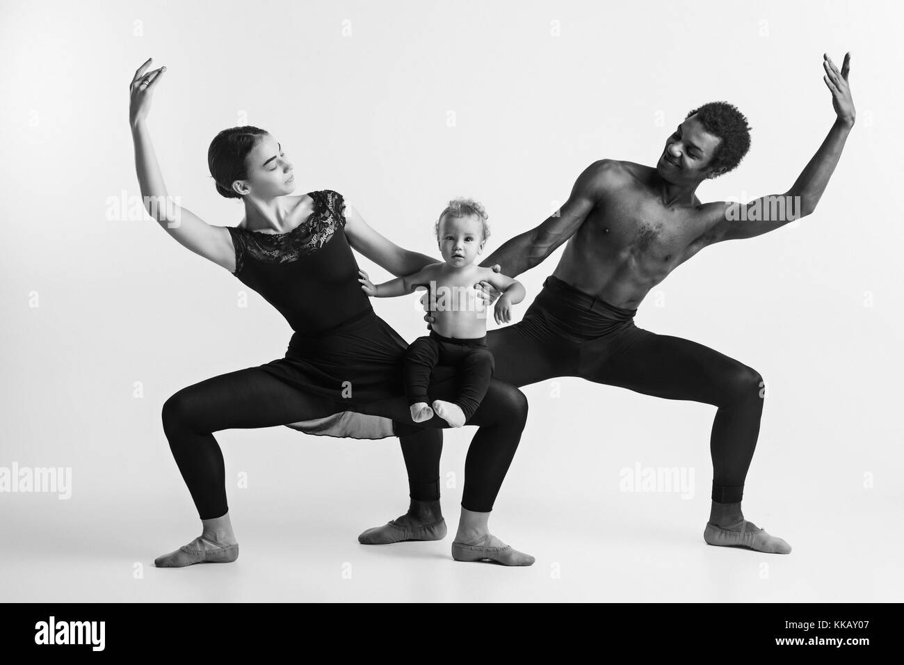 A happy family of ballet dancers on white studio background Stock Photo ...