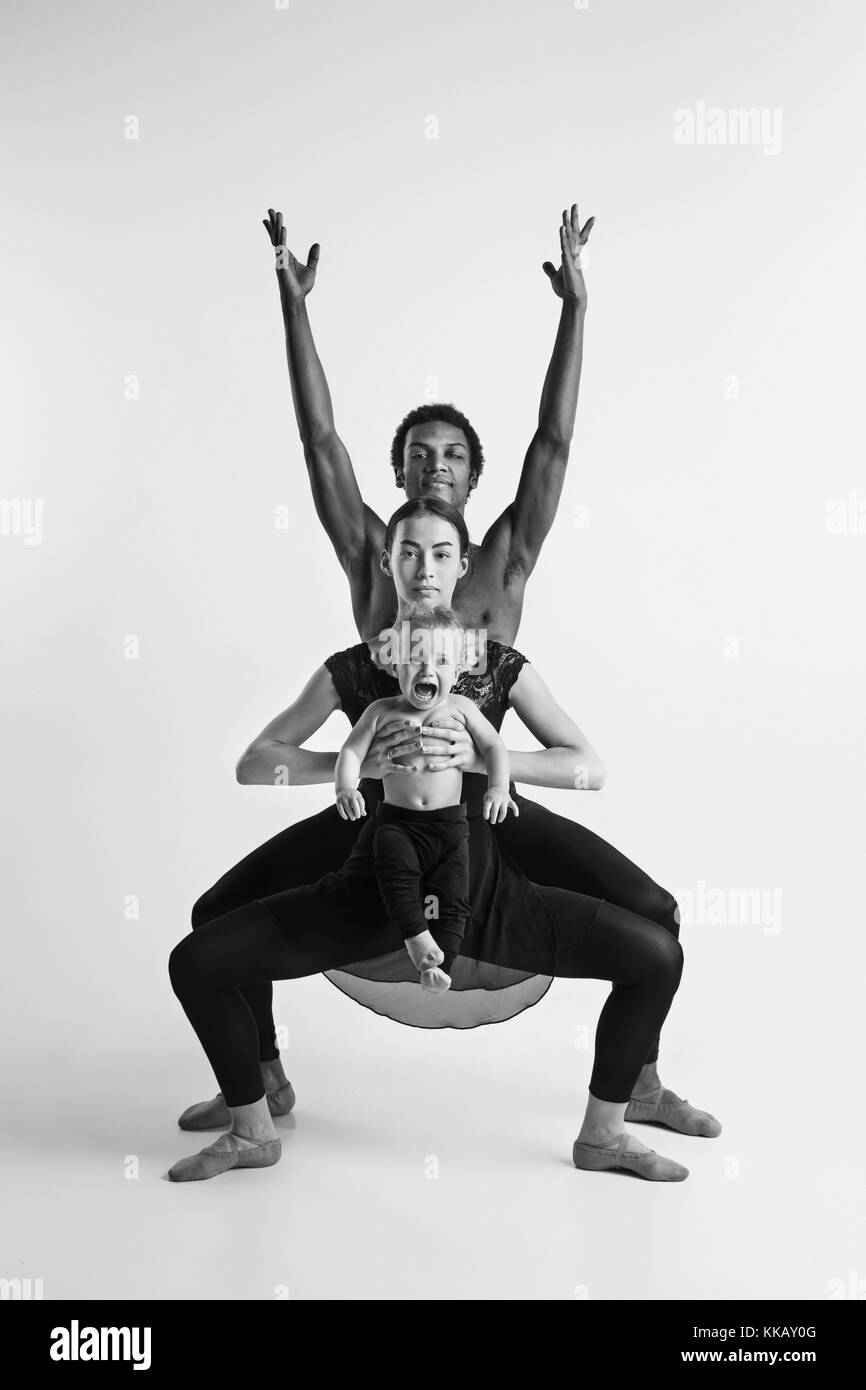 A happy family of ballet dancers on white studio background Stock Photo ...