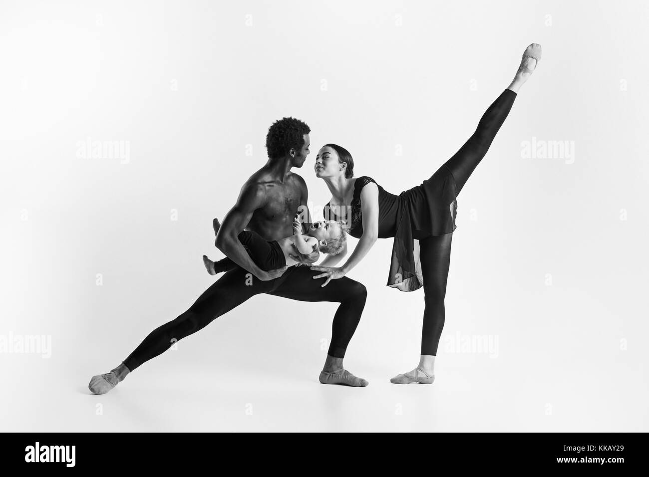 A happy family of ballet dancers on white studio background Stock Photo ...