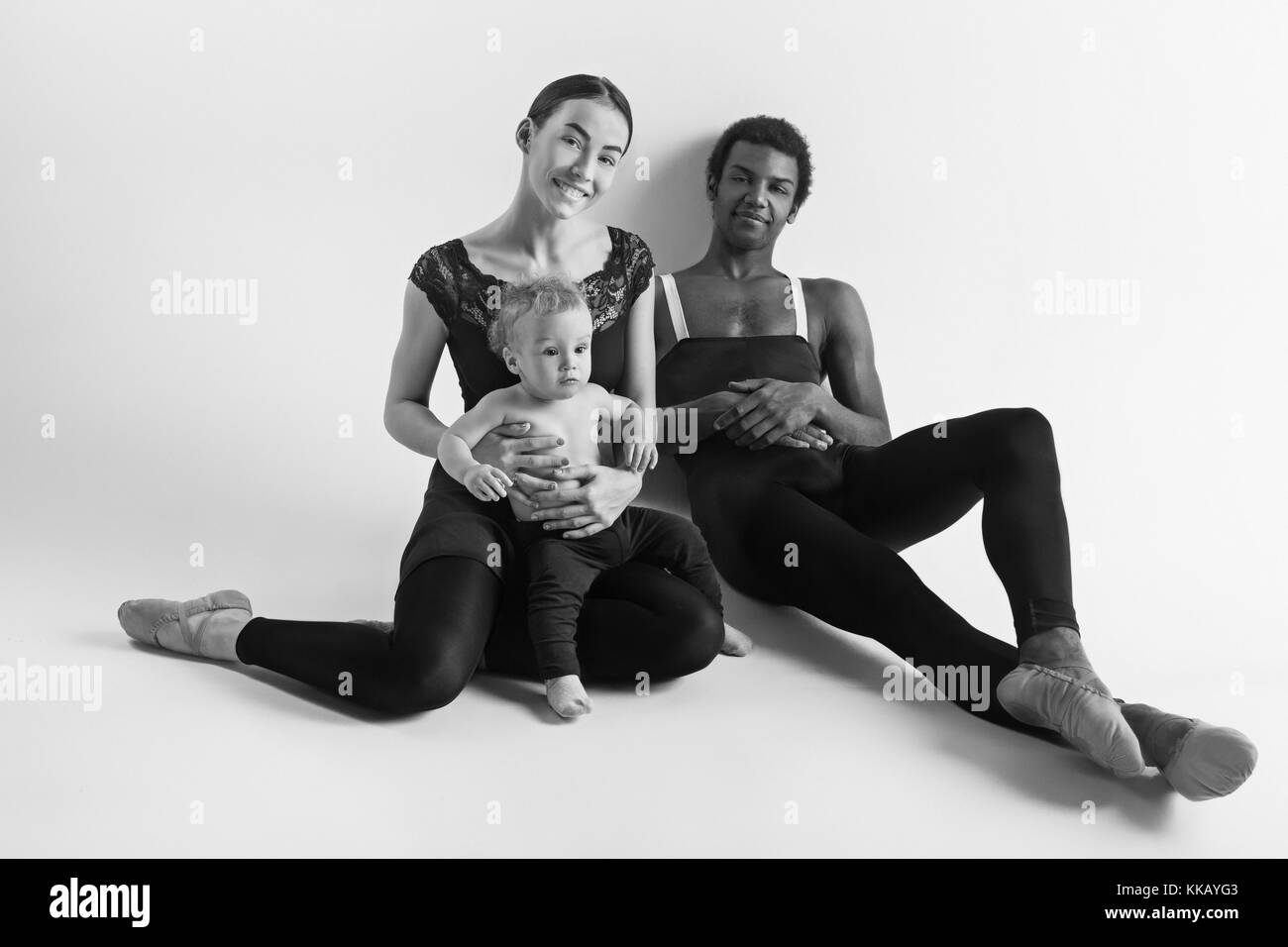 A happy family of ballet dancers on white studio background Stock Photo ...