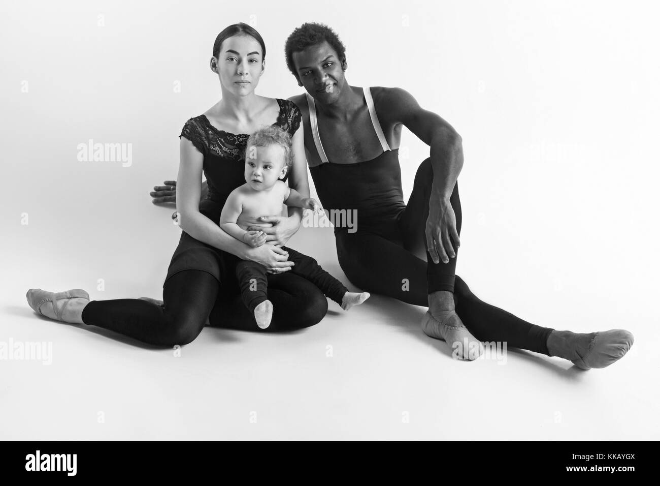 A happy family of ballet dancers on white studio background Stock Photo ...