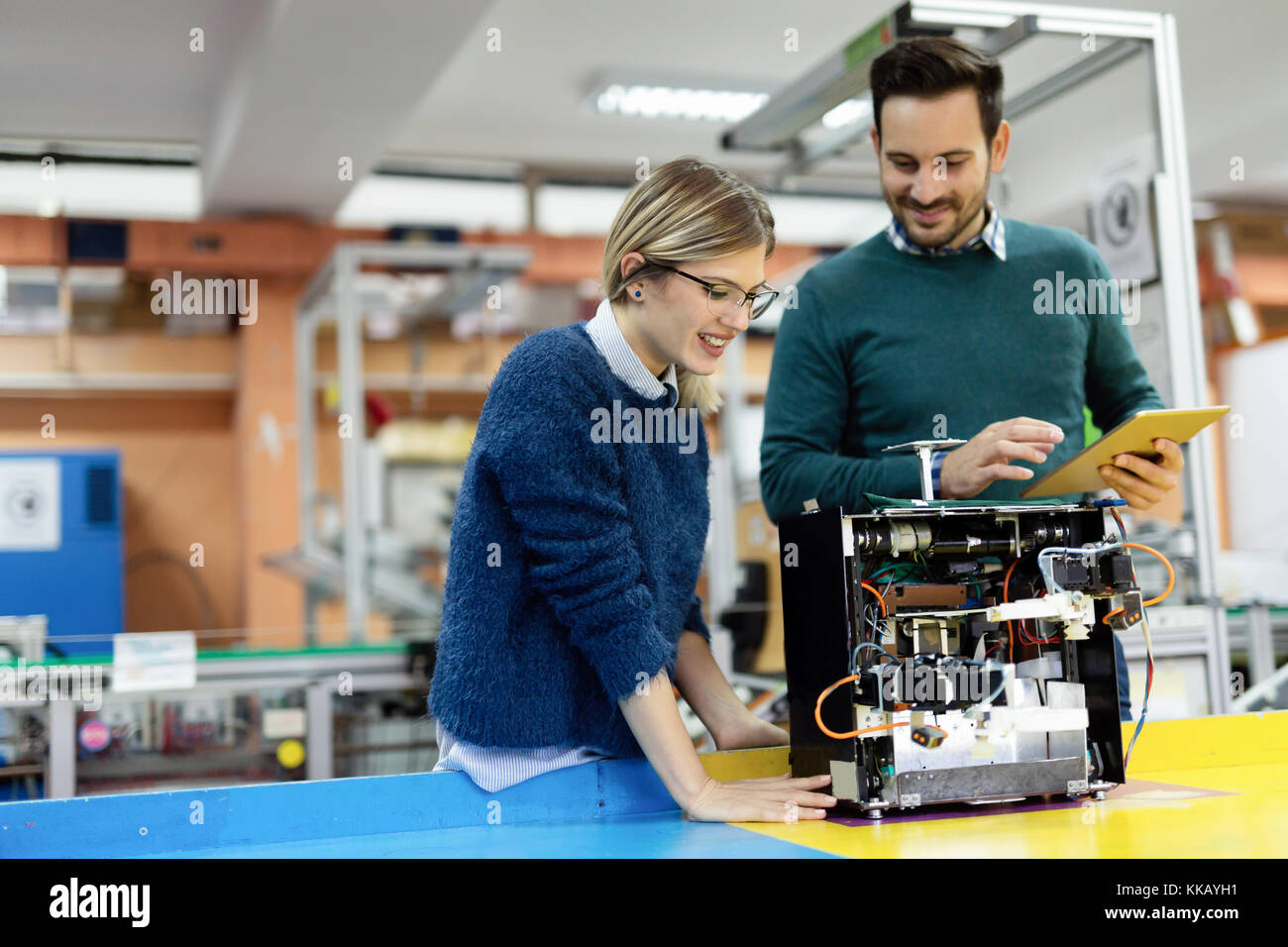 Young attractive students of mechatronics working on project Stock ...