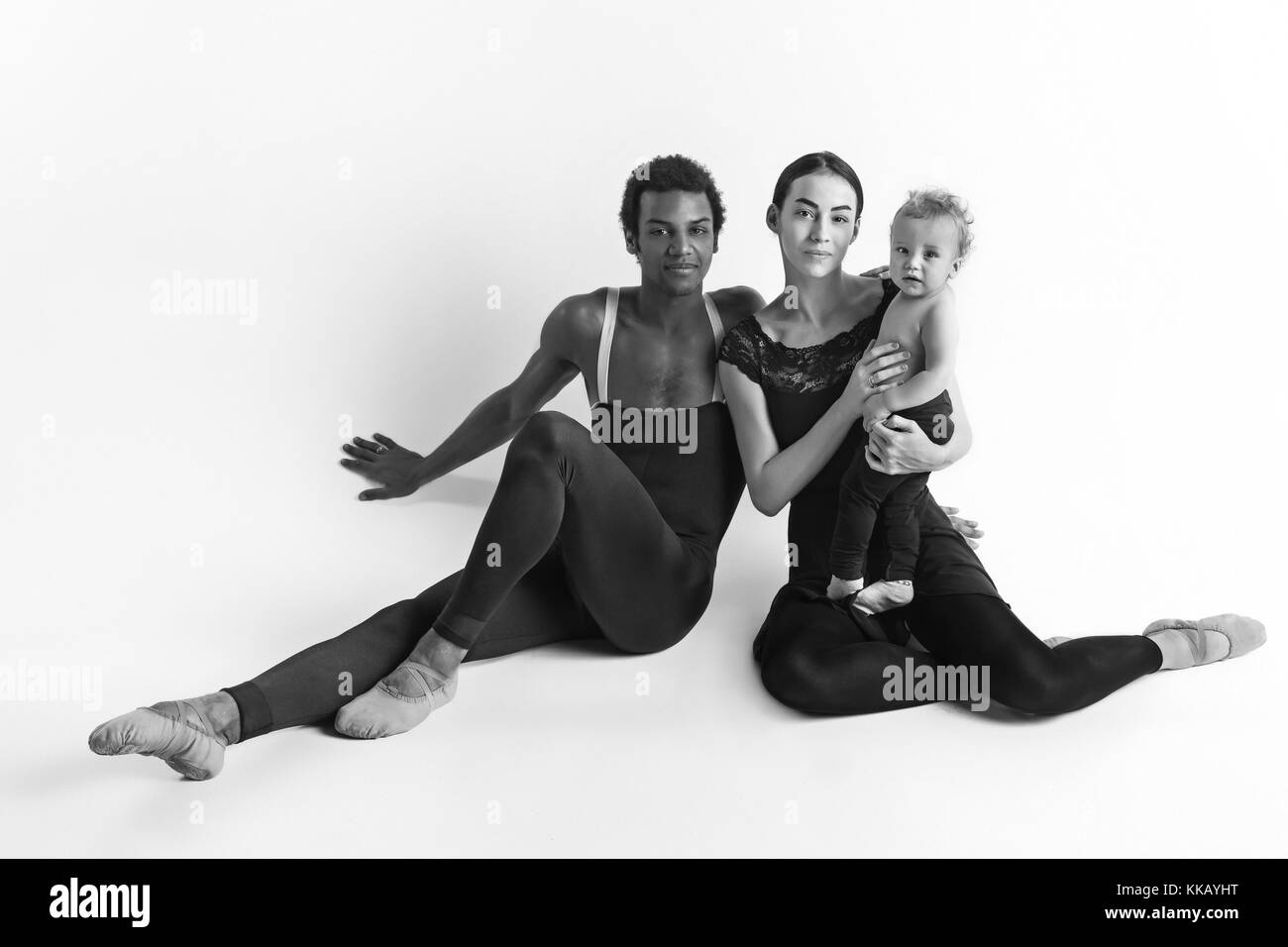 A happy family of ballet dancers on white studio background Stock Photo ...