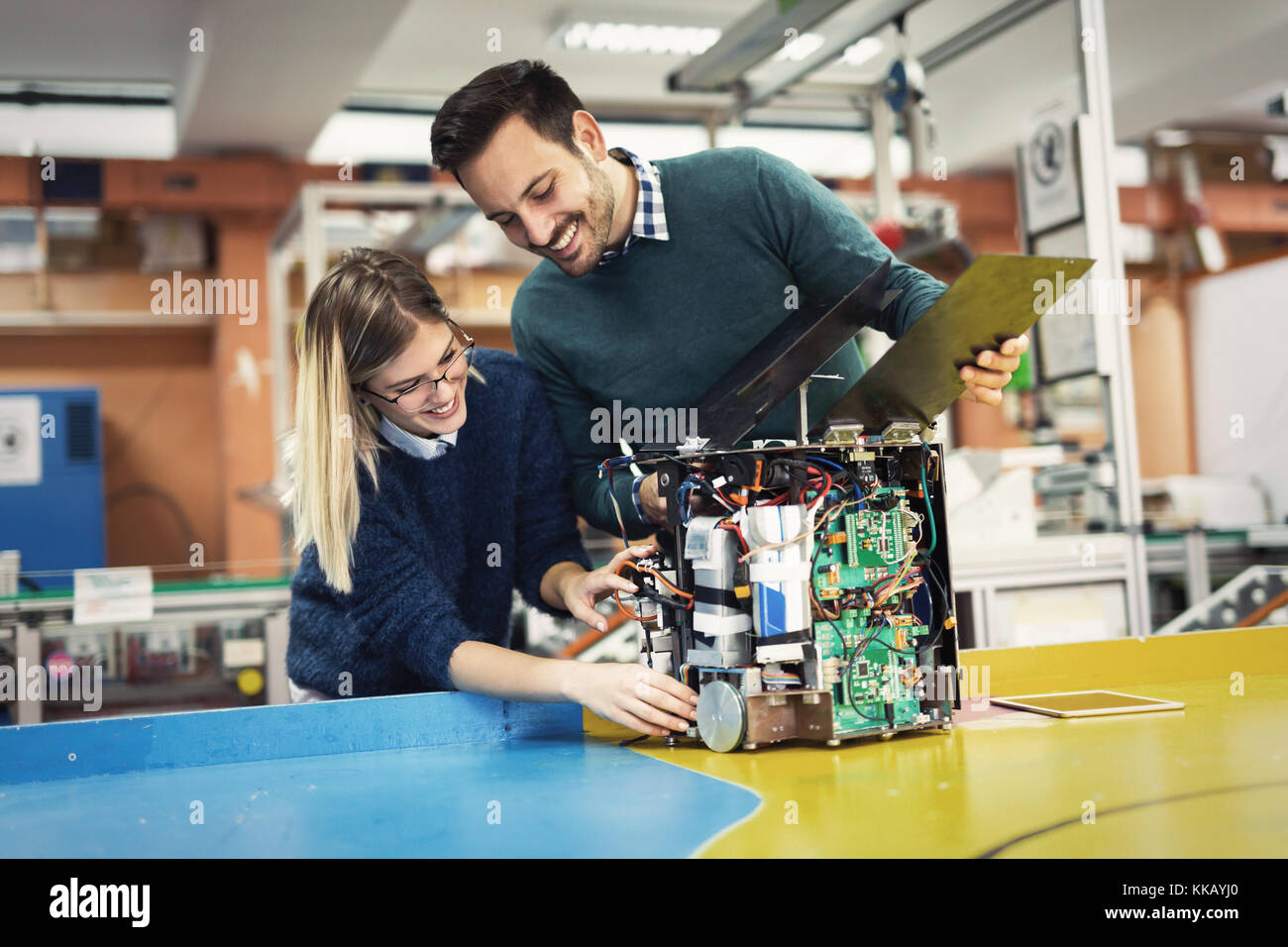Young attractive students of mechatronics working on project Stock ...