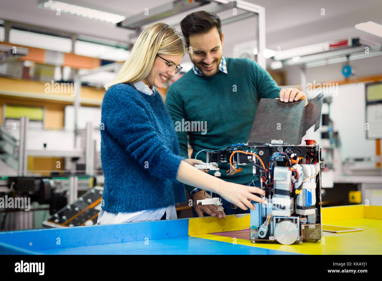 Young attractive students of mechatronics working on project Stock ...
