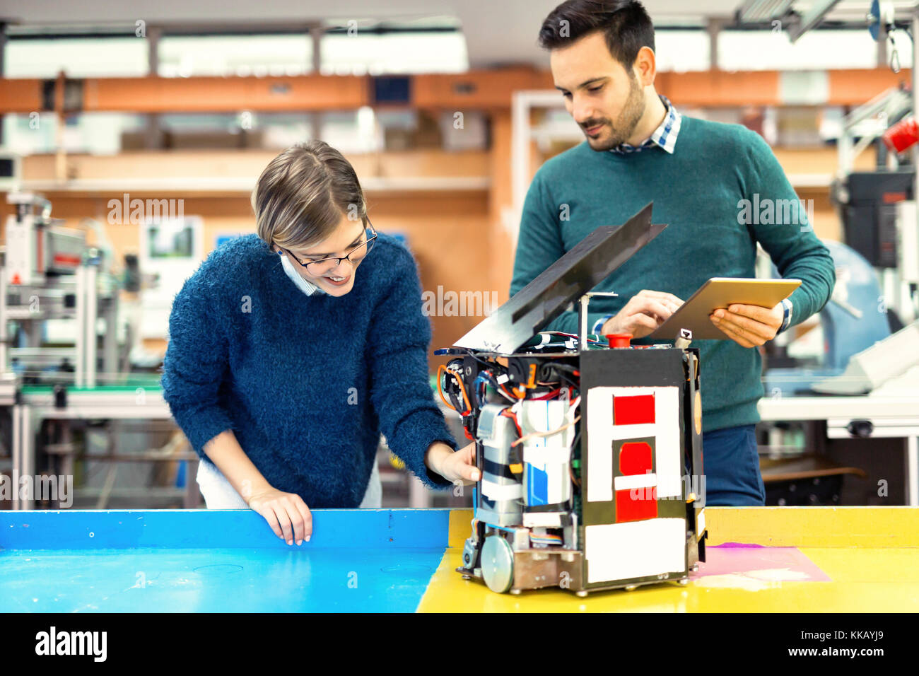 Young attractive students of mechatronics working on project Stock ...
