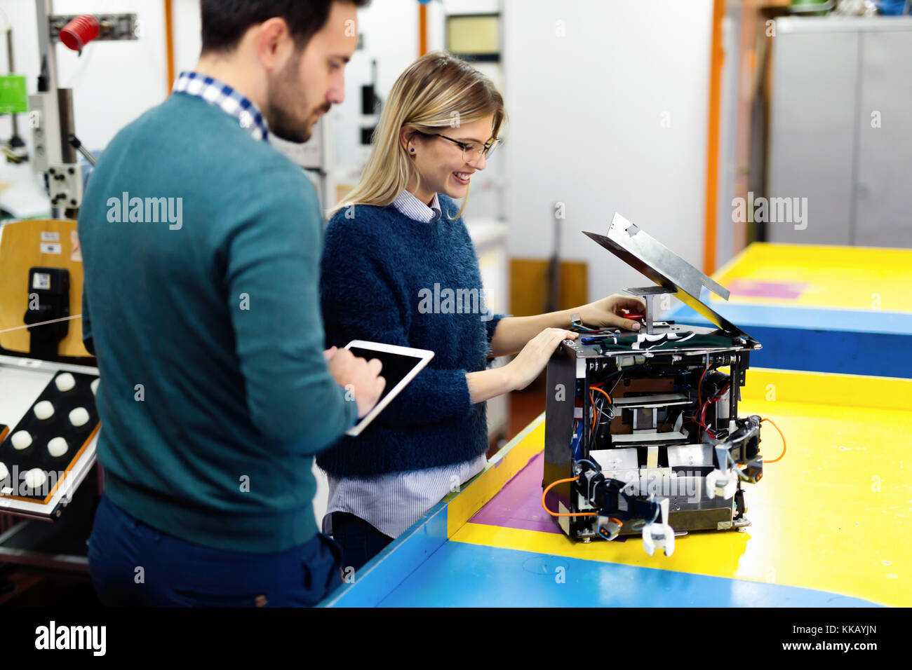 Young attractive students of mechatronics working on project Stock ...