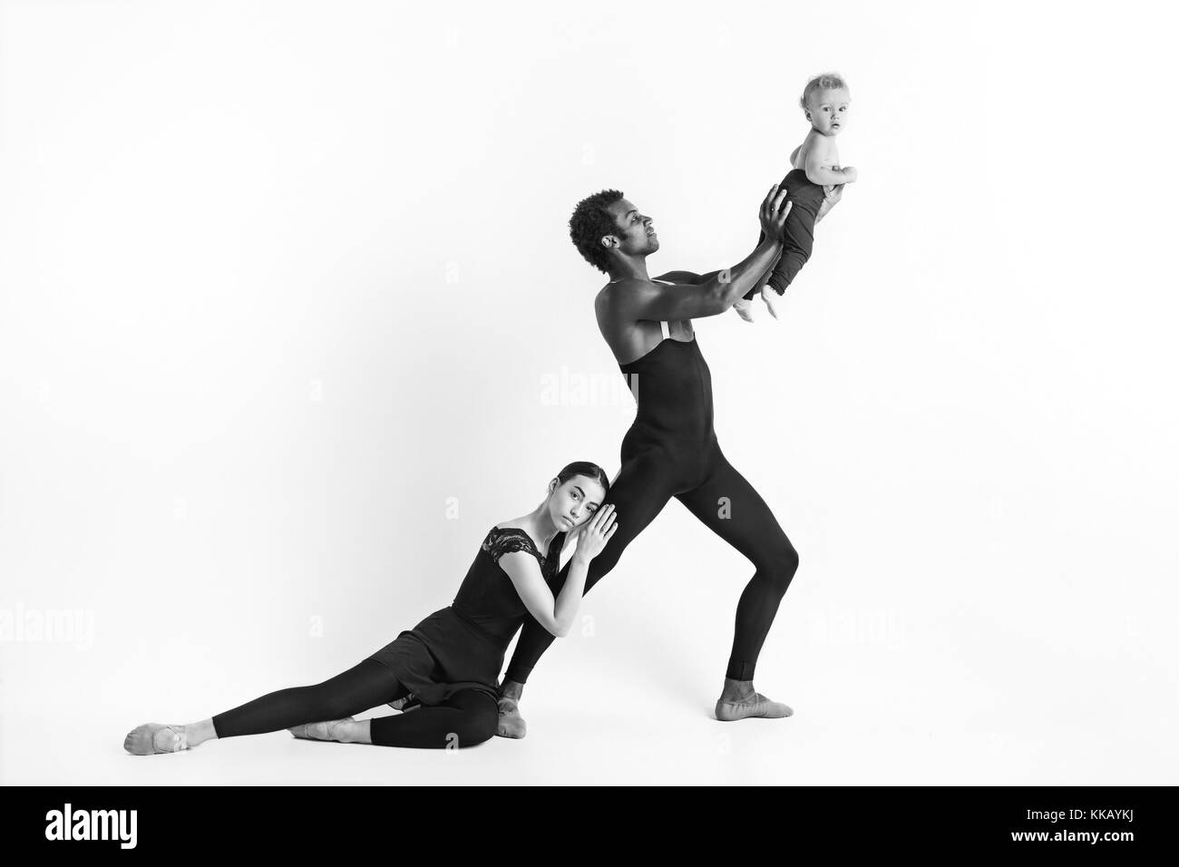 A happy family of ballet dancers on white studio background Stock Photo ...