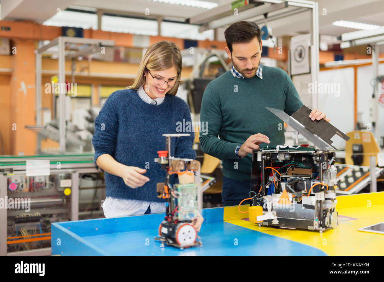Young attractive students of mechatronics working on project Stock ...