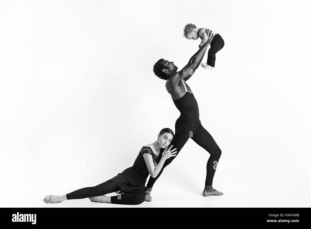 A happy family of ballet dancers on white studio background Stock Photo ...