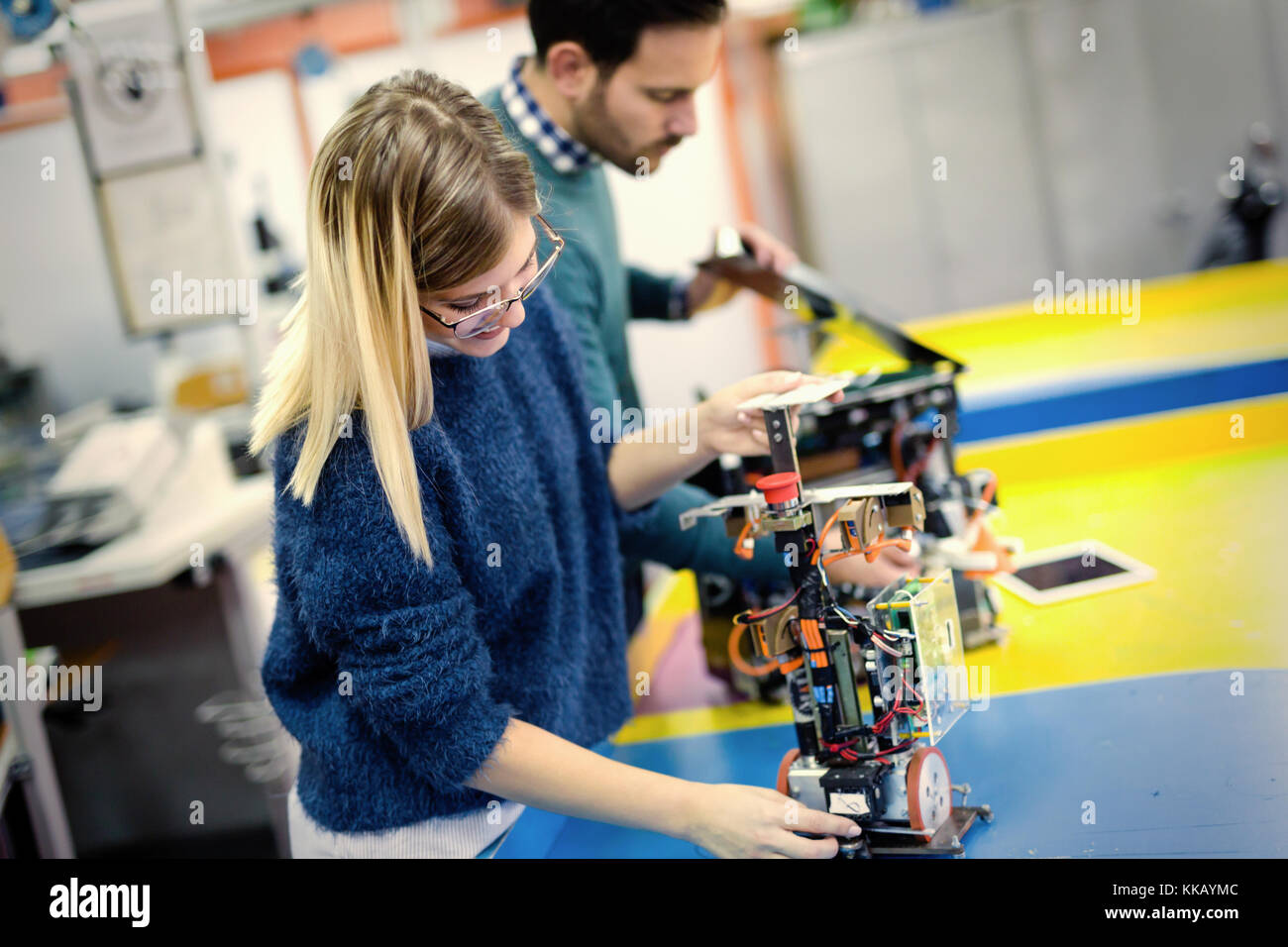 Young attractive students of mechatronics working on project Stock ...