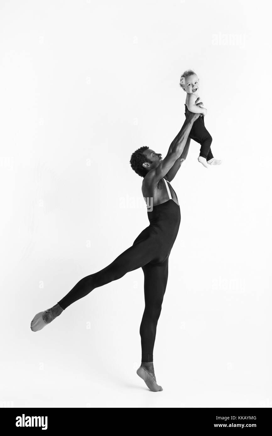 A happy family of ballet dancers on white studio background Stock Photo ...