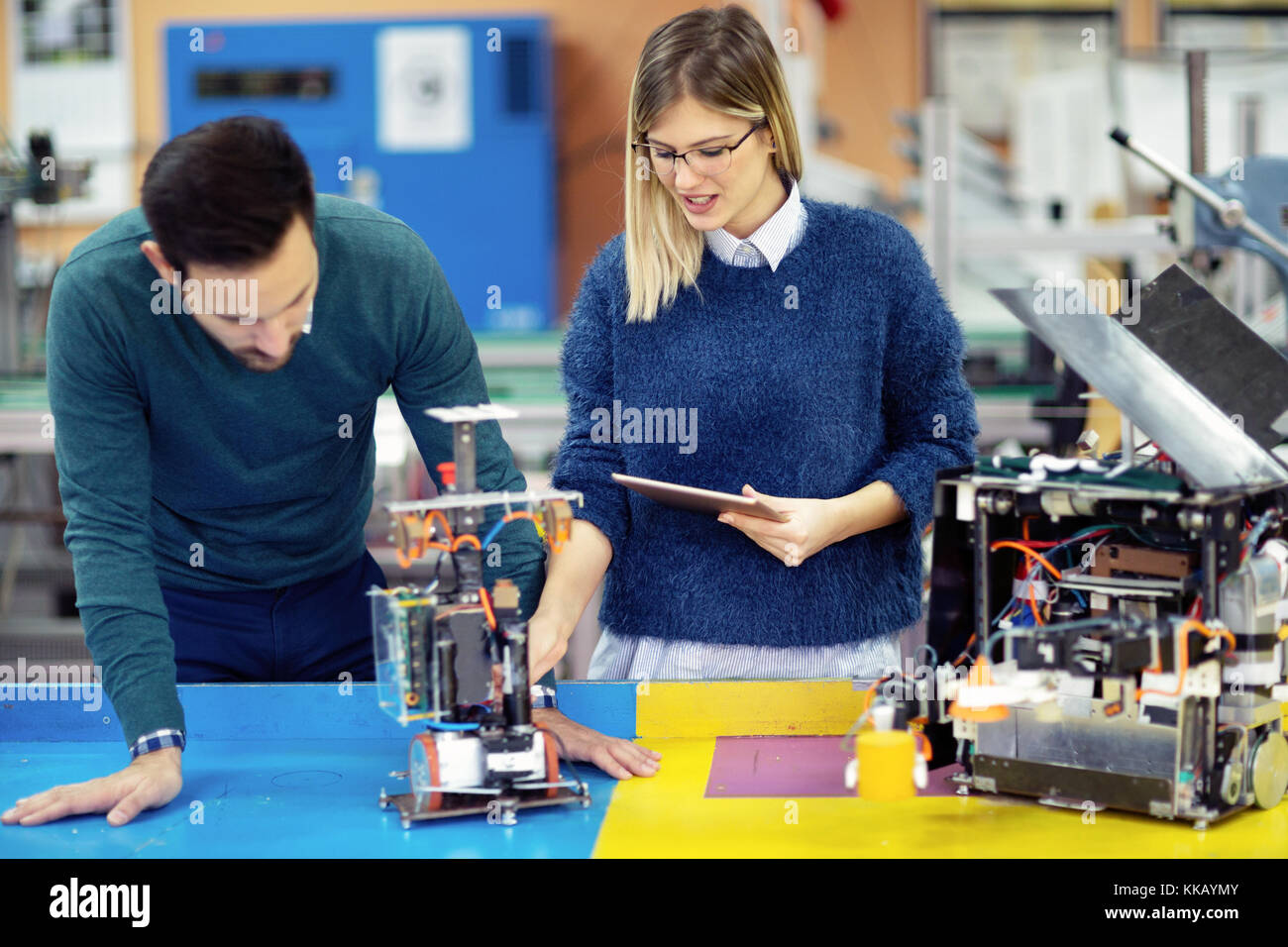 Young attractive students of mechatronics working on project Stock ...