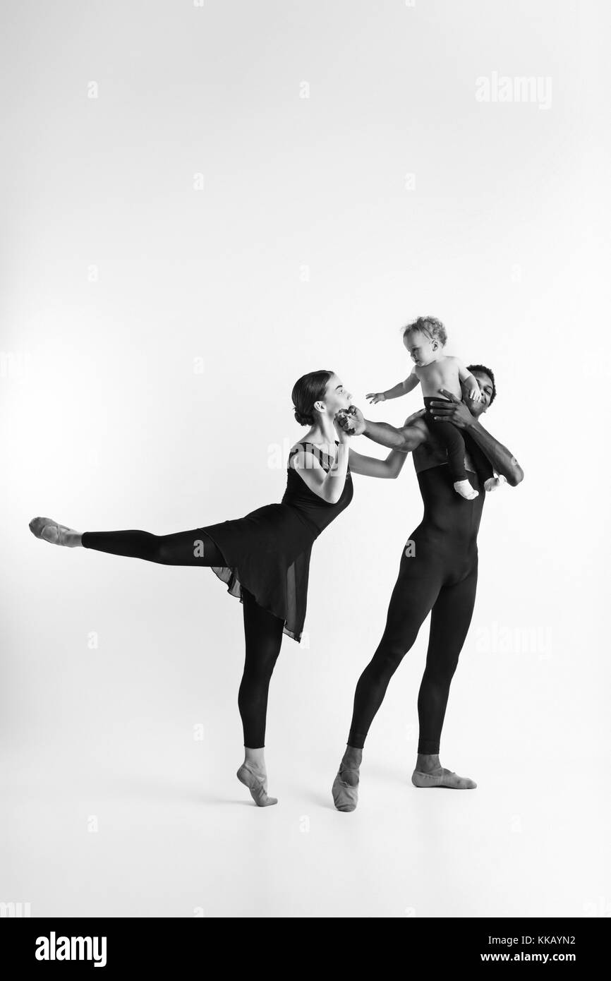A happy family of ballet dancers on white studio background Stock Photo ...