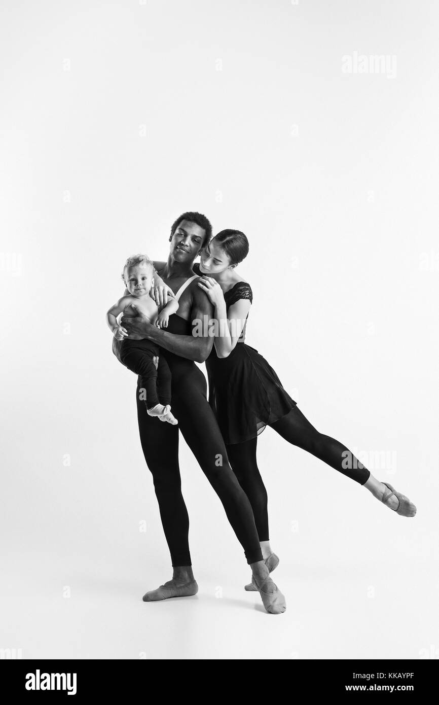 A happy family of ballet dancers on white studio background Stock Photo ...