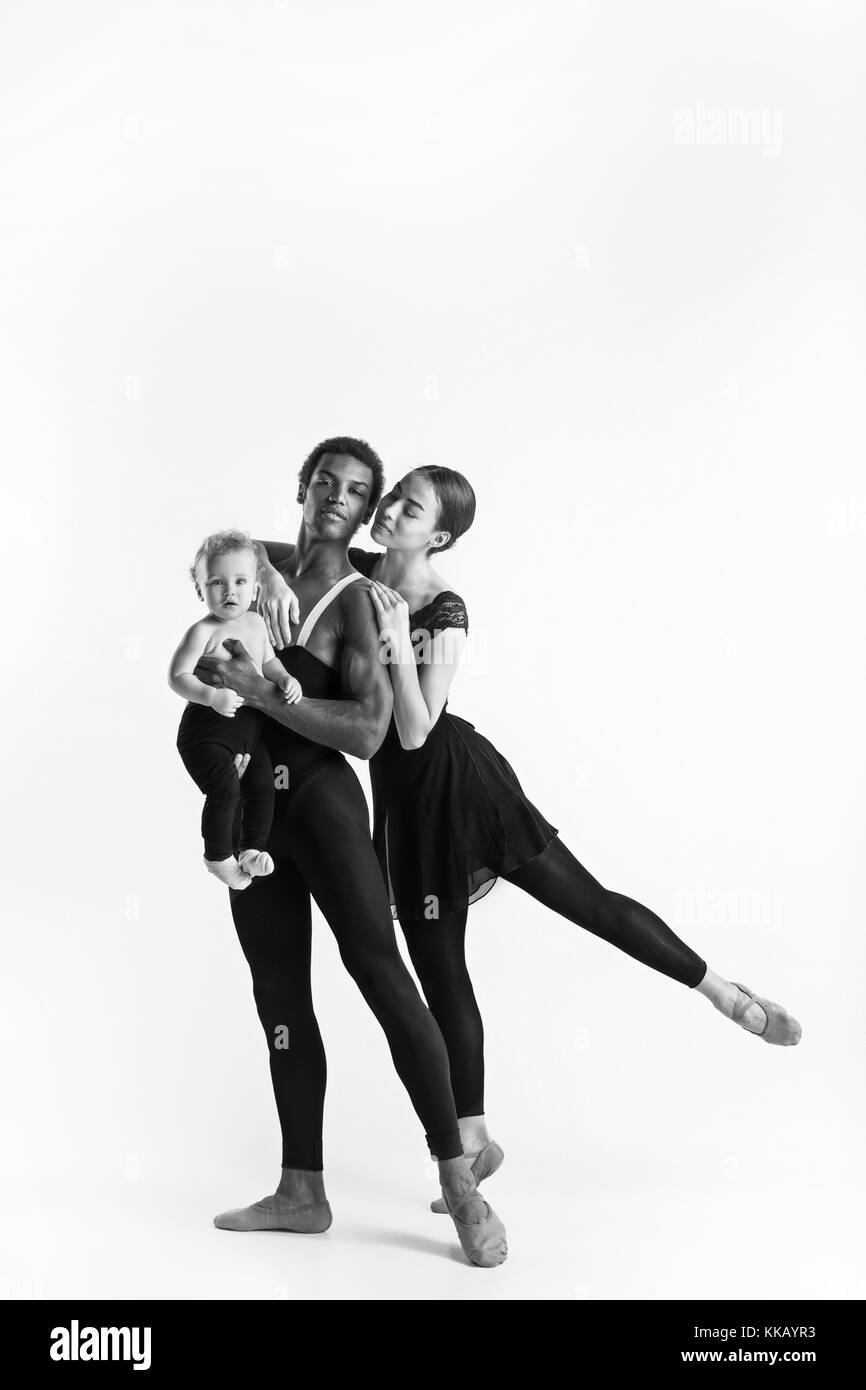 A happy family of ballet dancers on white studio background Stock Photo ...