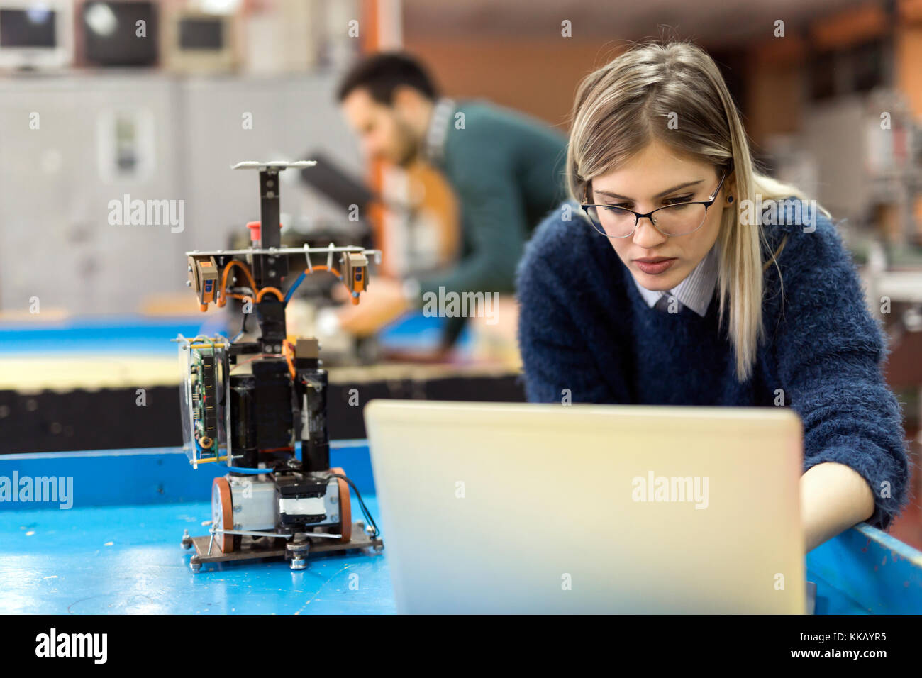 Young woman engineer working on robotics project Stock Photo - Alamy