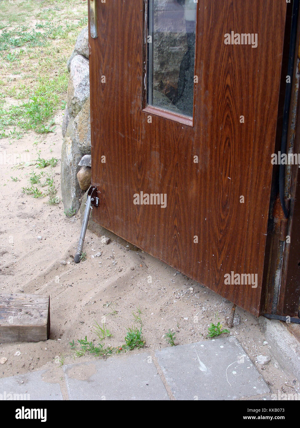 Opened cellar doors with fixator from metal tube and spring Stock Photo ...