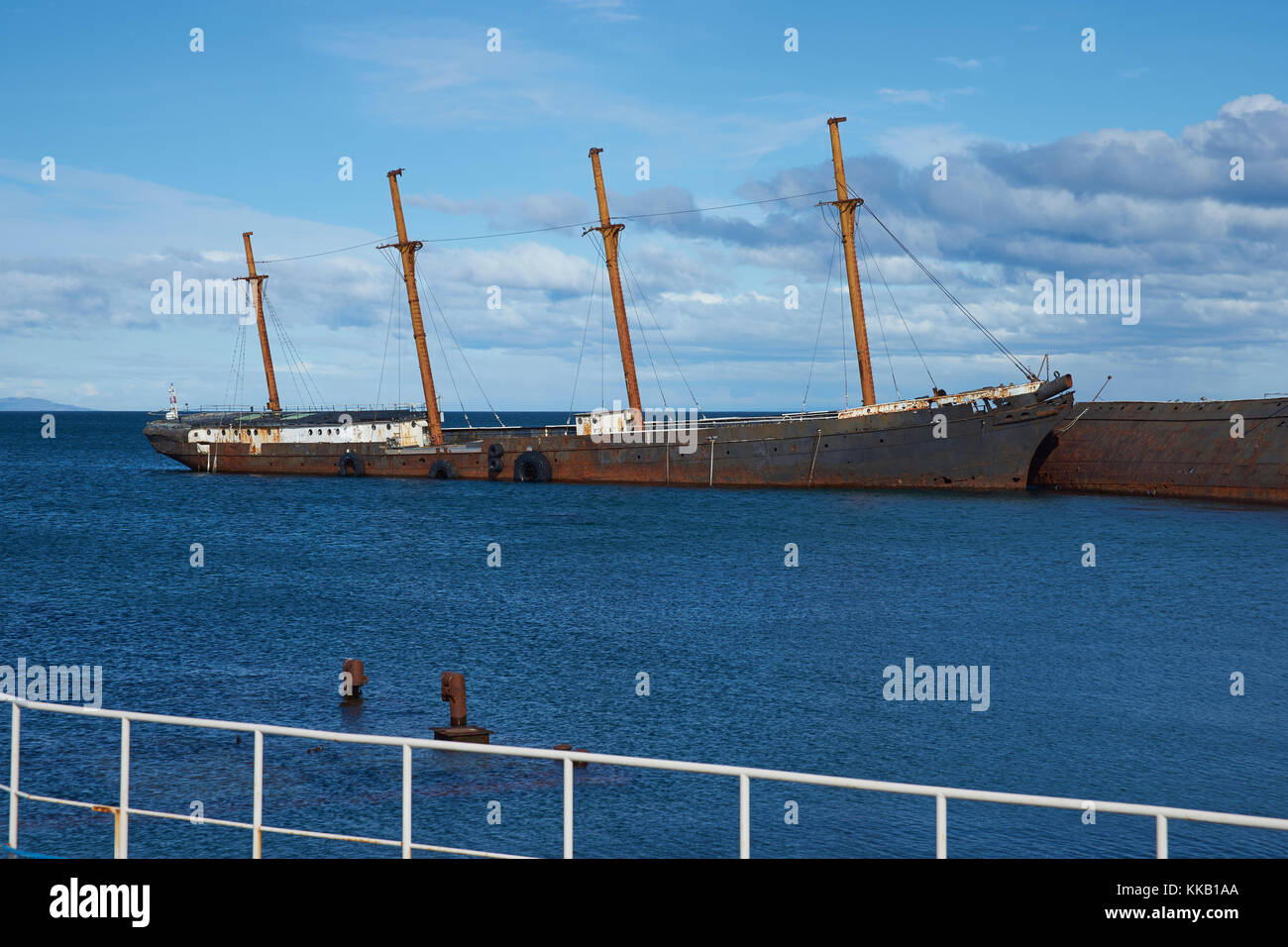 Rusting wreck of the ship County of Peebles moored alongside a pier in ...