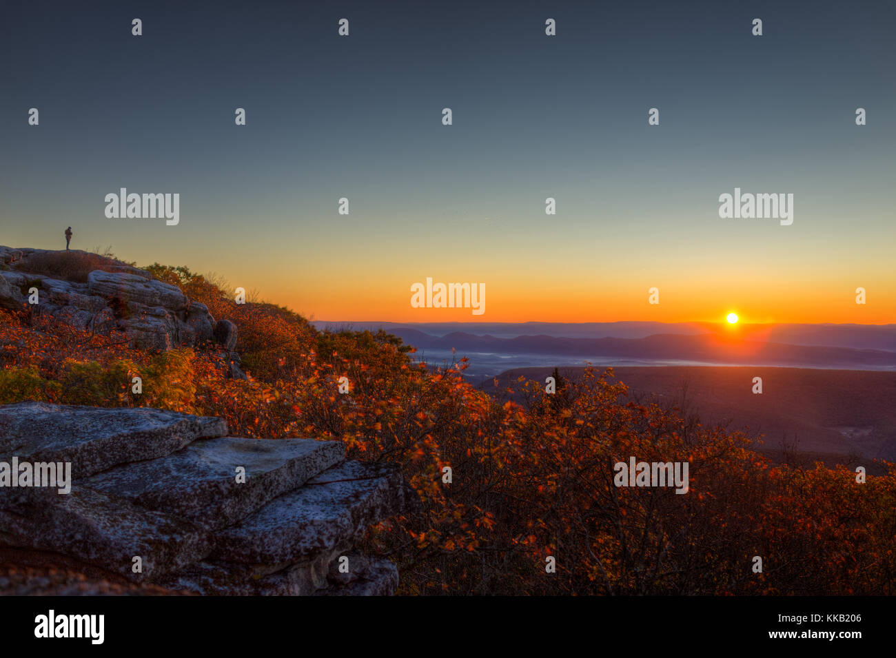 Standing man in distance silhouette far away on autumn morning in Bear ...