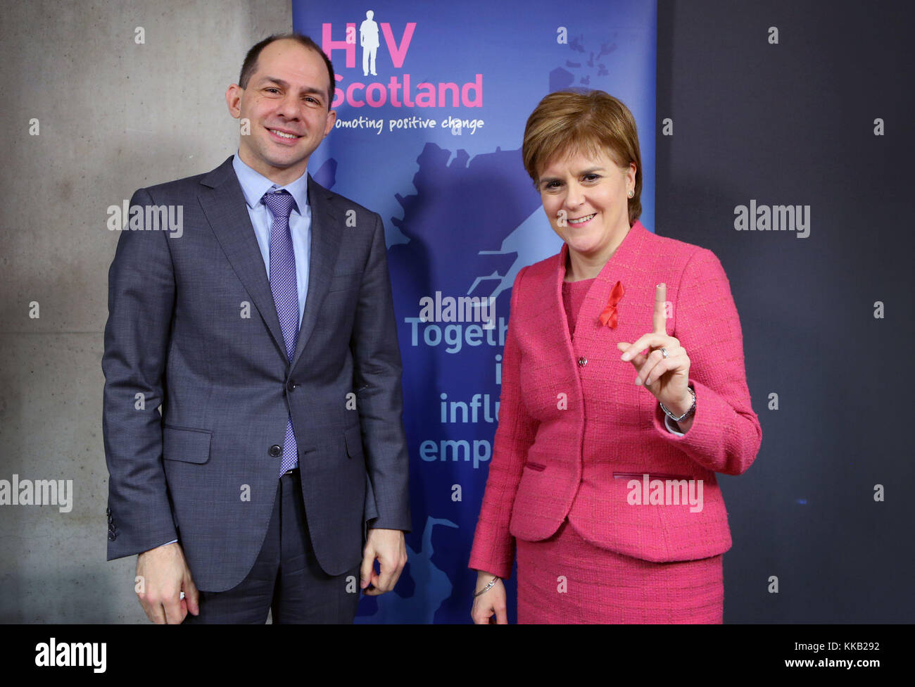 First Minister Nicola Sturgeon holds up her finger with a plaster on ...