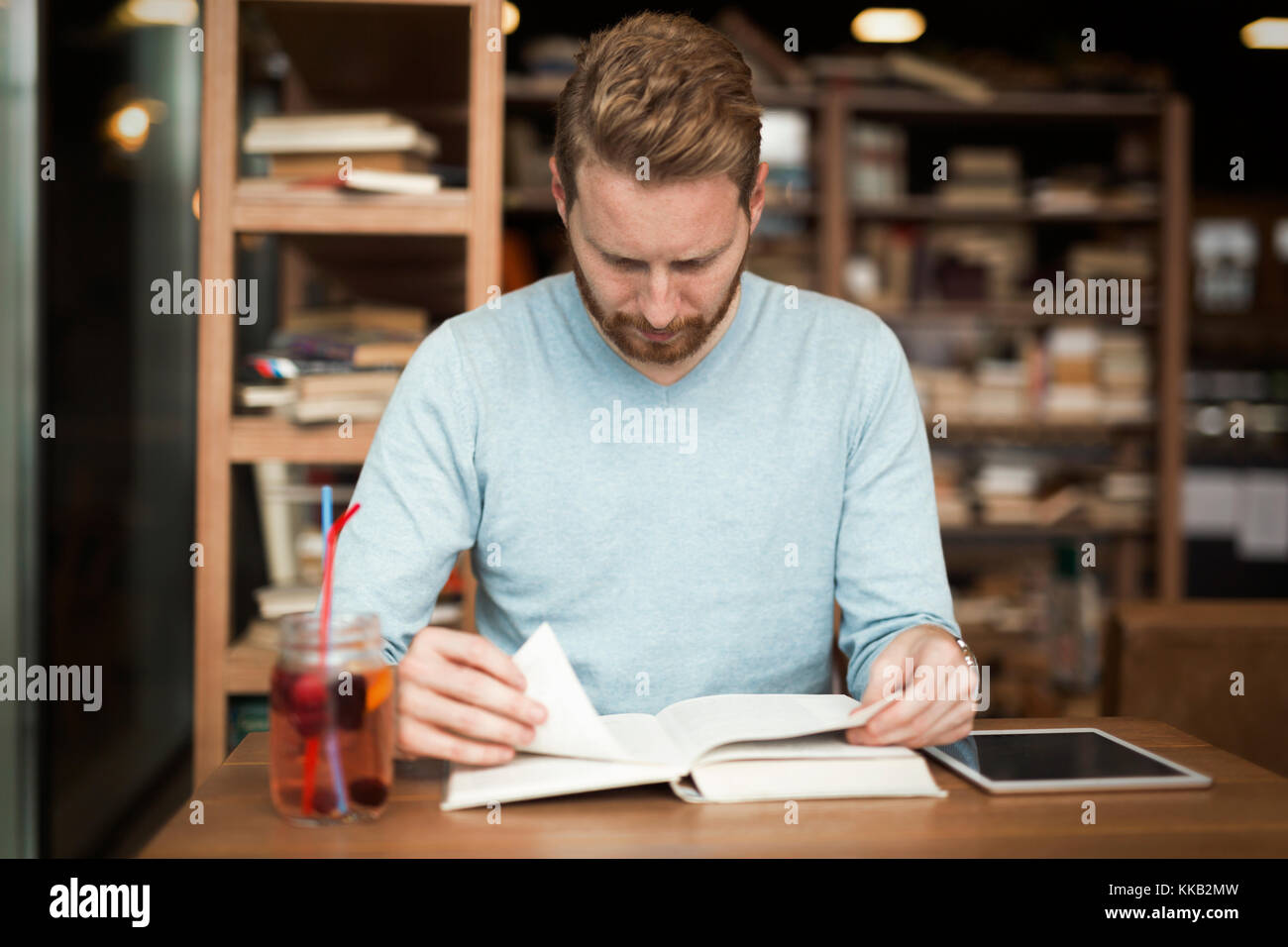 Male college student in library hi-res stock photography and images - Alamy