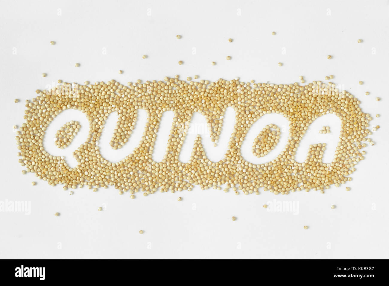 Quinoa written with raw grains on white background Stock Photo - Alamy