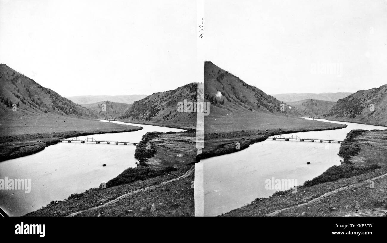 Stereograph taken from a long distance of the Madison Bridge spanning a ...
