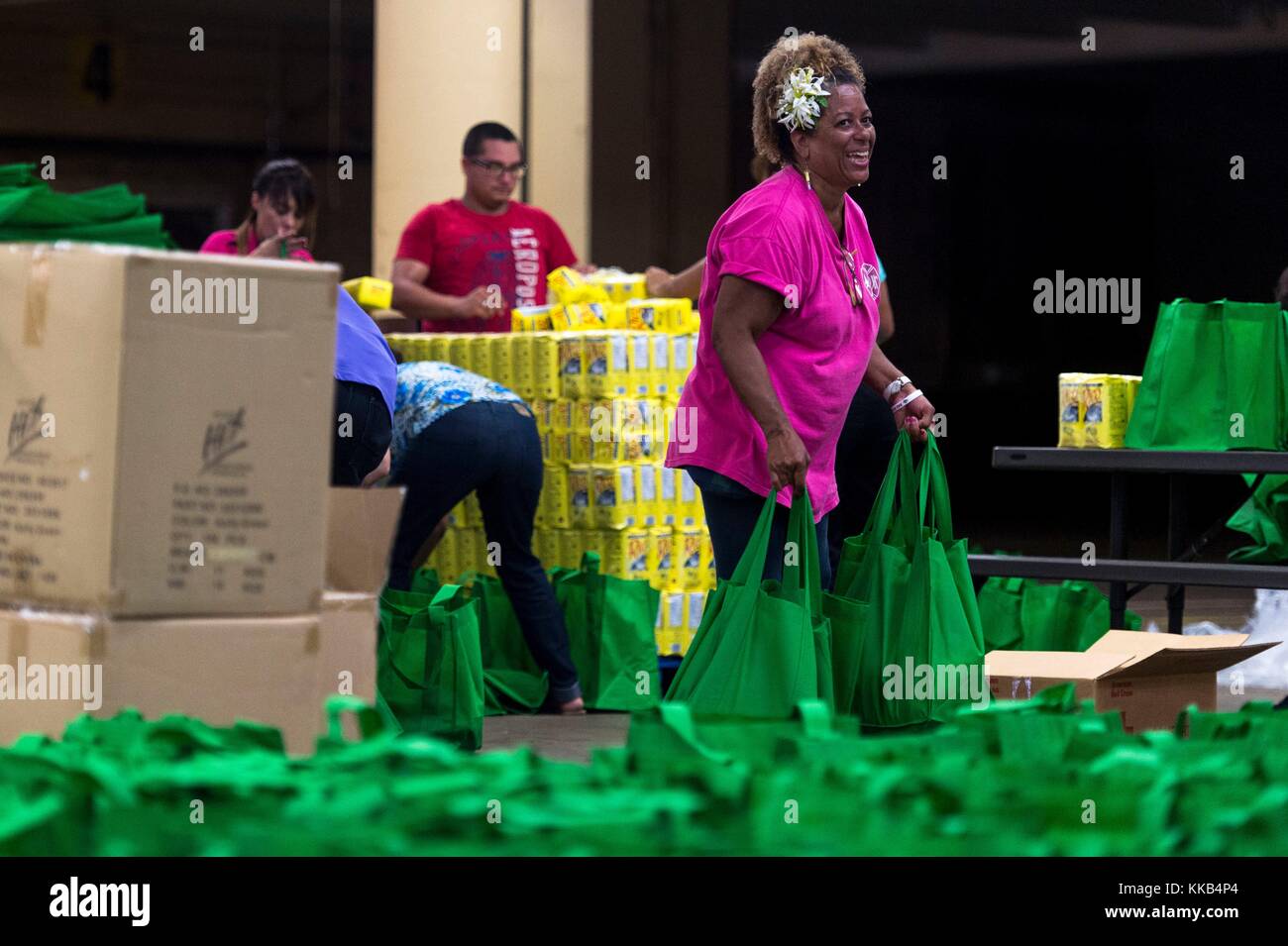 FEMA and American Red Cross volunteers pack emergency supplies for ...