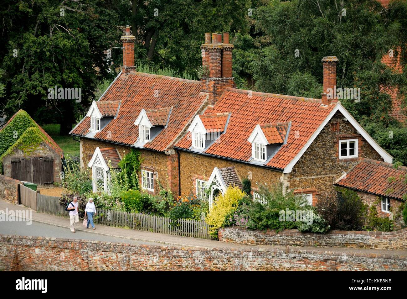 Red brick cottages with dormer windows and gardens in village of Castle ...