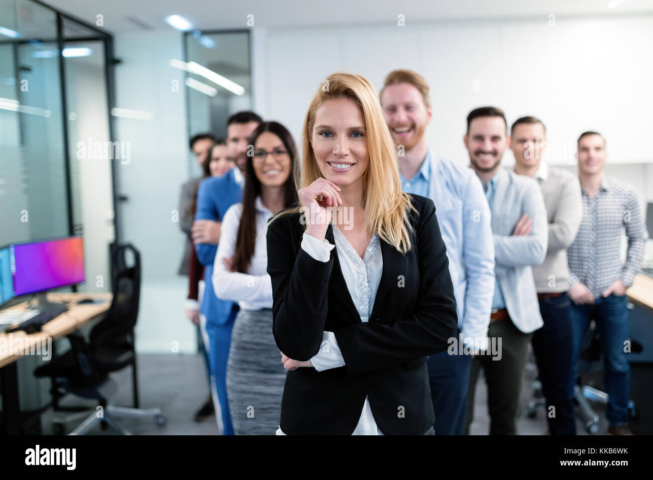 Group picture of business team posing in office Stock Photo - Alamy