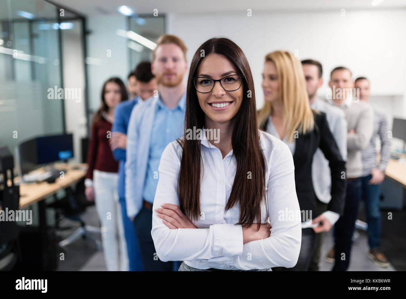 Group picture of business team posing in office Stock Photo - Alamy