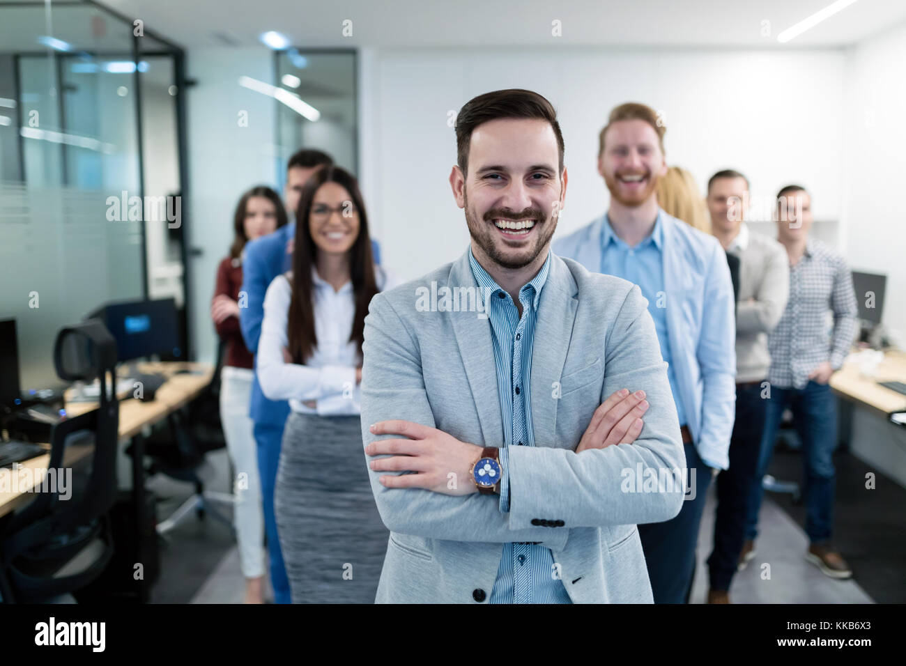 Group picture of business team posing in office Stock Photo - Alamy