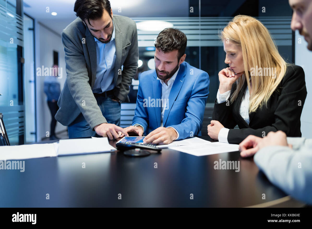 Business team working together on project in office Stock Photo - Alamy